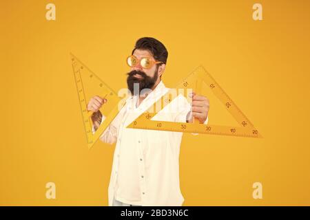 Smart student. Geometry teacher. Student using measuring instrument ...