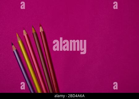 Multi colored crayons at magenta background with copy space Stock Photo ...
