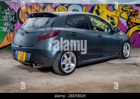 Modified Madza 2 compact car Stock Photo - Alamy