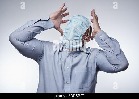 Man with exaggerated mask protection, whole face covered, making him ...