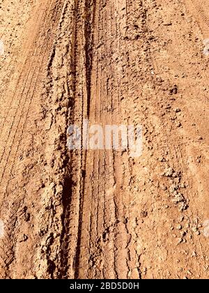 Muddy bumpy path in detail. Impassable road Stock Photo - Alamy