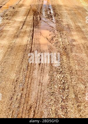 Muddy bumpy path in detail. Impassable road Stock Photo - Alamy