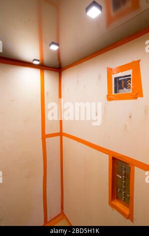Elevator walls protected with plywood sheets during construction work ...