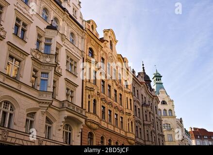 Baroque and bohemian buildings with decorated facades in Prague (Czech ...