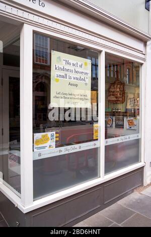 Poster in shop window quoting one of Aesops sayings Stock Photo - Alamy