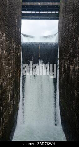The Duckbill type (Morning Glory type) spillway in operation during ...