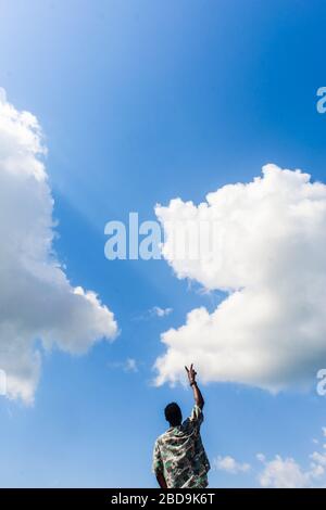 Christian praying to God and man shouting with arms raised to God, pain ...