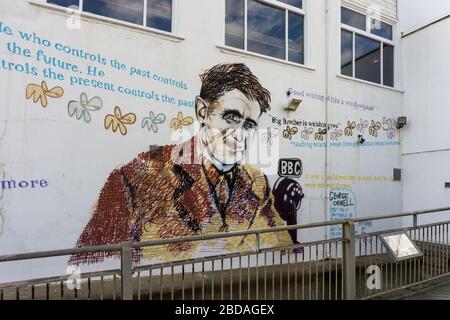 Artwork by street artist 'Pure Evil' inspired by George Orwell. Southwold Pier, Southwold ...