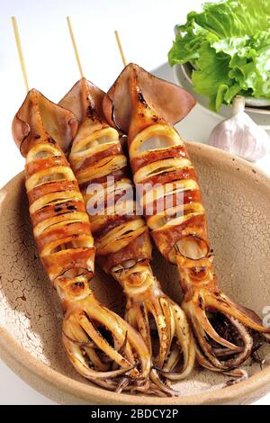 Roast Squid kabob Stock Photo - Alamy