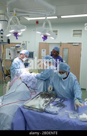 NHS Surgeons perform laparascopic surgery on a patient's stomach while ...