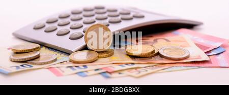 Euro banknotes and coins Stock Photo - Alamy