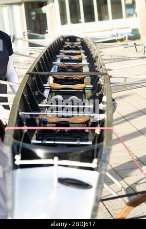 a Look inside a professional carbon fiber rowing boat with seats and ...