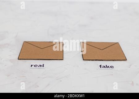trust-wrothy vs fake emails or online scams concept, email envelop ...