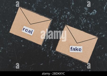 trust-wrothy vs fake emails or online scams concept, email envelop ...