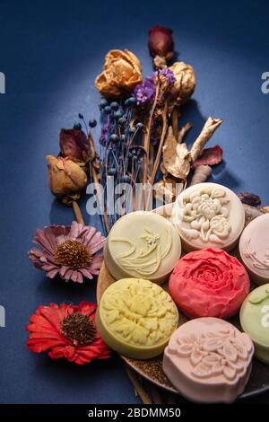 Moon cake with dried flower close-up Stock Photo - Alamy