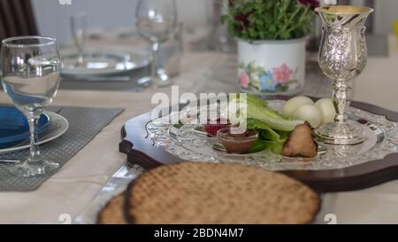 Passover table setting with a traditional Passover seder plate with ...