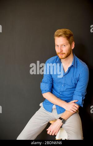 Photo of young redhair beard mustache man good hairstyle touch chin ...