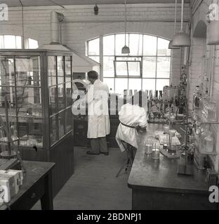 1950s, historical, male and female lab technicians in white coats ...