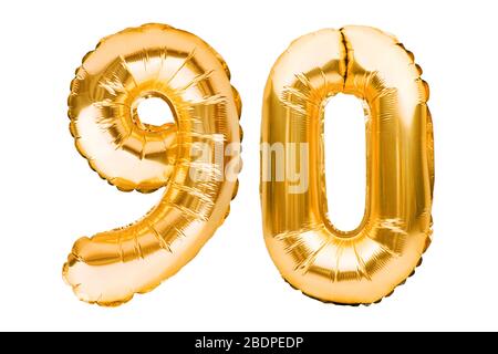 Number 90 gold birthday celebration balloon on a confetti glitter ...