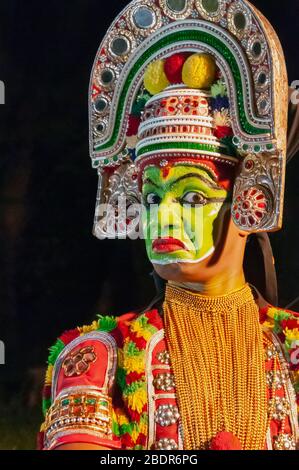 Traditional Indian Hindu dancer with painted face and exotic costume ...