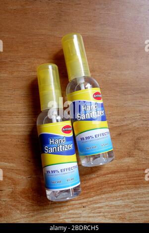 Medical bottles on hand isolated on white Stock Photo - Alamy