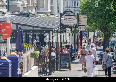 Shops, cafes and restaurants in Llandudno town centre Stock Photo - Alamy