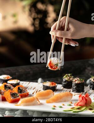 Chopsticks holding shrimp, tuna, salmon cubes. Hand-painted watercolor ...