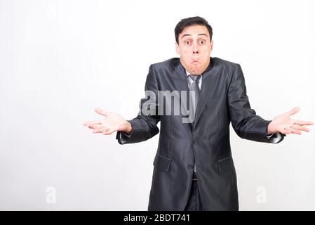 Doubting man in suit. White background, full body Stock Photo - Alamy