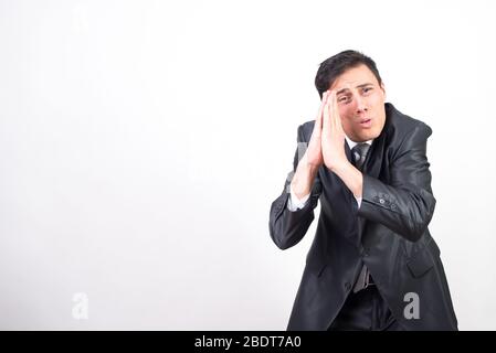 Man in suit begging. White background, full body Stock Photo - Alamy