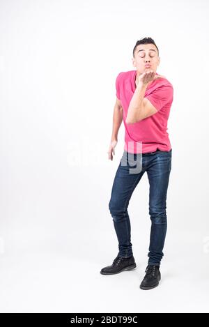 Man throwing a kiss. White background, full body Stock Photo - Alamy