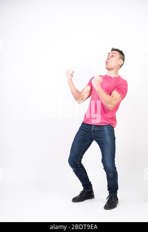 Euphoric man celebrating something. White background. Full body Stock ...
