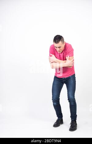 Man getting very cold surrounding his body with his arms. white ...