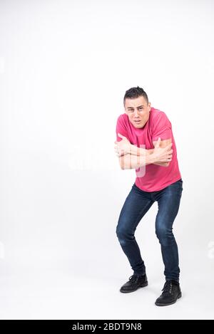 Man getting very cold surrounding his body with his arms. white ...
