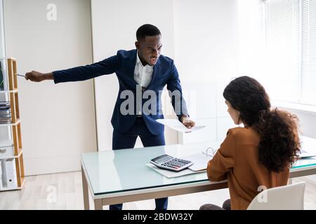 Male boss firing a female employee isolated on white background Stock ...