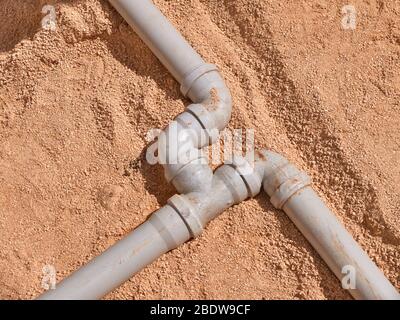 Junction of plastic sewer pipes. Sewage pipeline system of residential ...