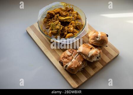 Traditional South African curry pickled snoek meal, served with freshly ...
