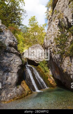 Small waterfall at the gorge of Enipeas river, at the foot of Mount ...