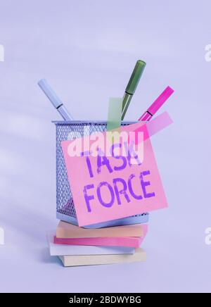 Task Force. Sticky note with text on wooden texture office table Stock ...