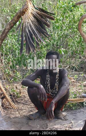 Hadza tribe of Tanzania, East Africa. Making fire by rubbing wood ...