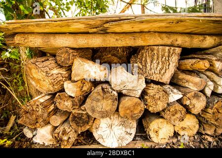 fuel-wood stock at an old abbey wall Stock Photo - Alamy