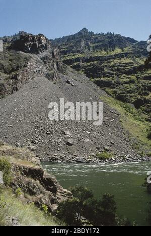 Talus fan or cone of scree and cliff debris at the foot of a granite ...