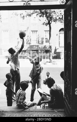 Children play basketball in the 1970's on a playground in the 1970's ...