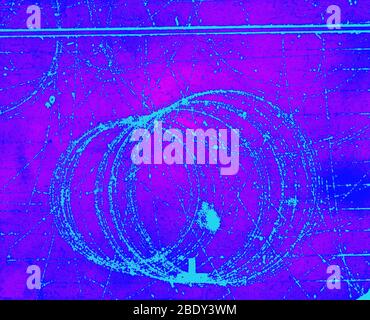 Circular track of 42 Meu positron in 12,000 gauss magnetic field. The ...
