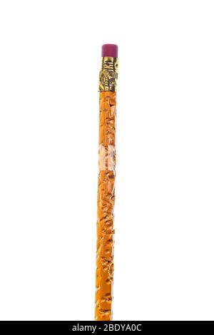 Vertical shot of the eraser end of one badly chewed pencil. Leaning ...