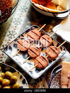 fried bacon and sausage on stick, slanina,traditional food in Romania ...