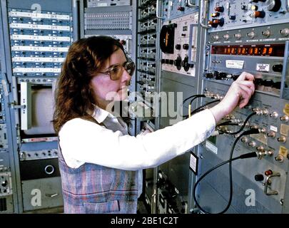 A computer engineer inputs data into a computer panel in the telemetry ...