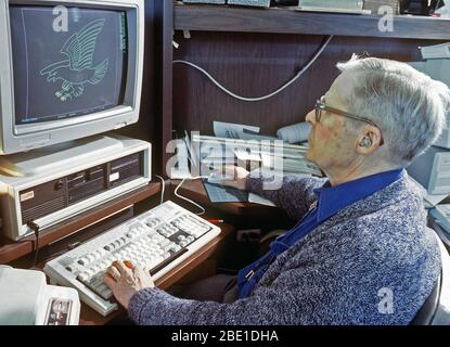 1992 - A heraldic specialist uses a computer to design a military ...