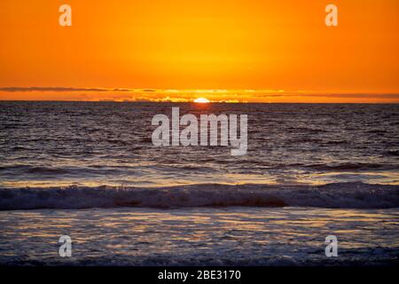 glooming sun rising over the sea Stock Photo - Alamy