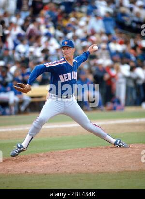 New York Mets pitcher David Peterson looks to the outfield as he walks ...