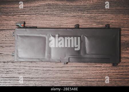 Lithium-ion laptop battery that has swollen Stock Photo - Alamy